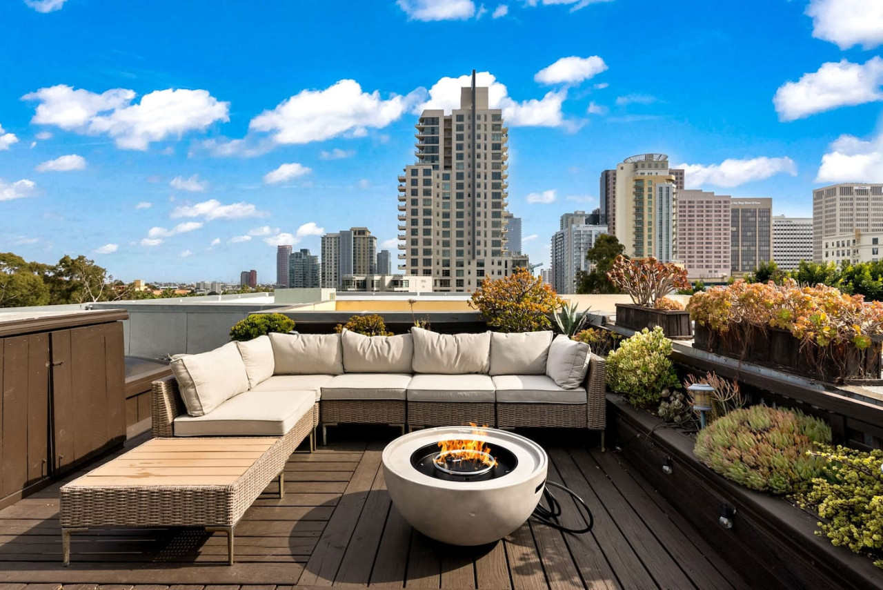 City Lights & Rooftop Nights: Chic Apartment with | Lake.com Rentals ...